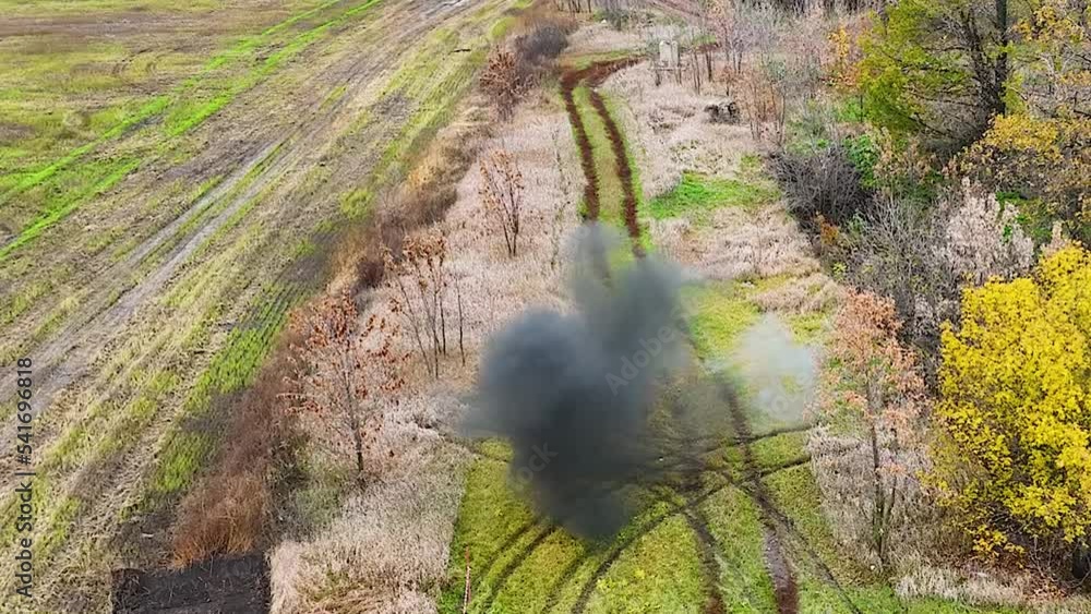 The explosion of a shell or mine on a country road. After the explosion ...