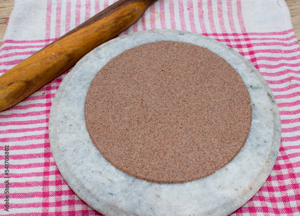 making round roti with the Dough of Ragi Nachni or finger millet flour ...