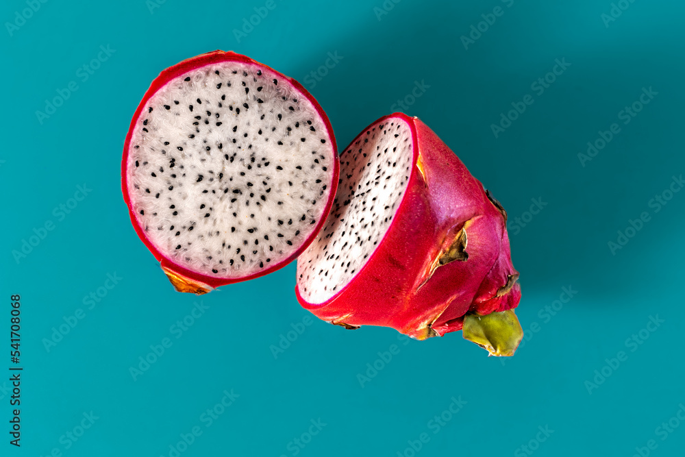 Exotic fruit known as pitaya, seen from above with a blue background ...