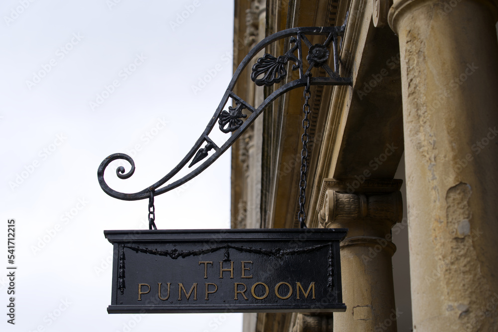 Sign pump room at famous roman bath at City of Bath on a cloudy summer ...