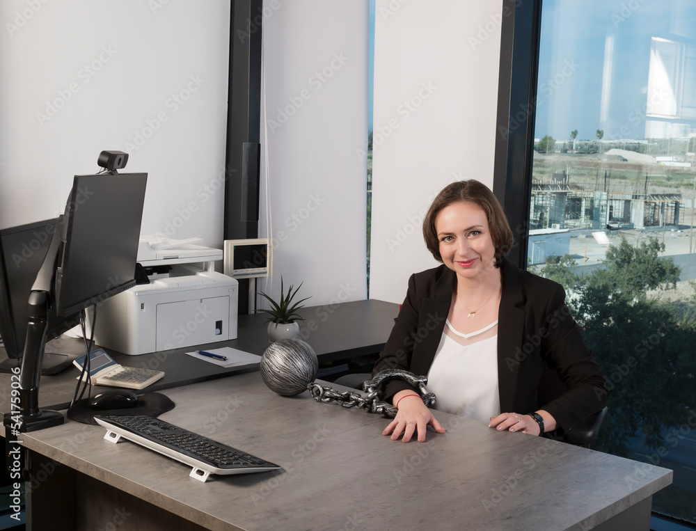 Businesswoman smiling in office, training with dumbbells. Female ...