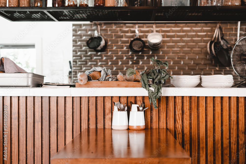 table and cutlery in a restaurant kitchen Stock Photo | Adobe Stock