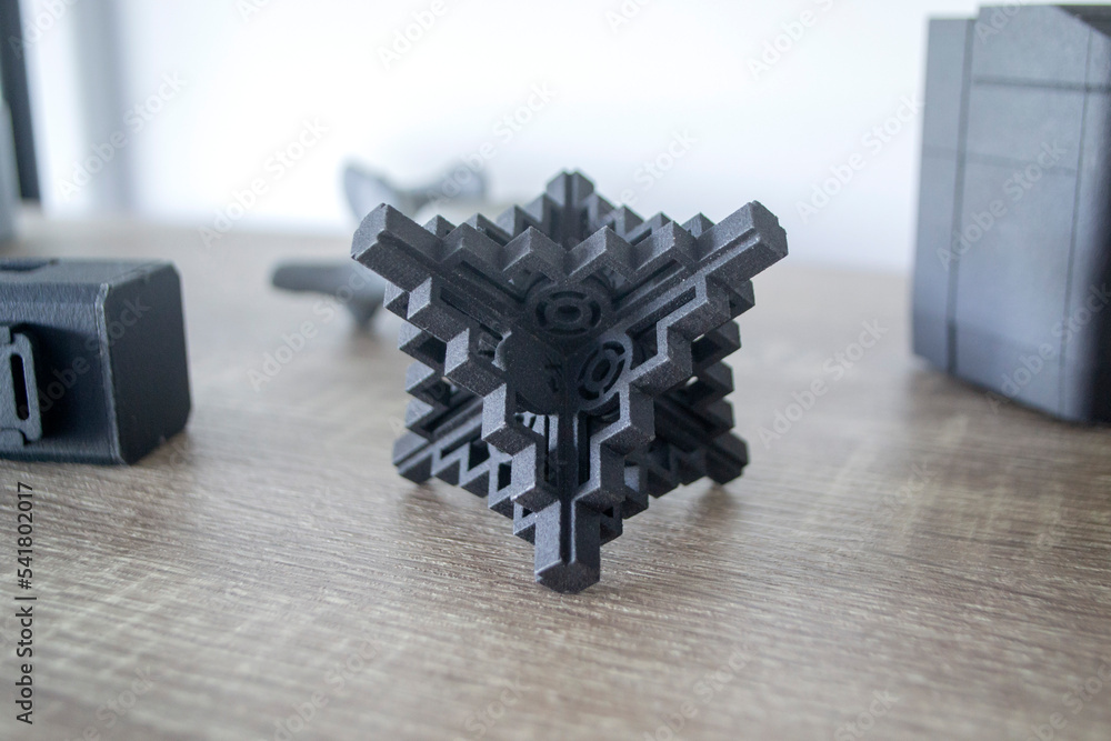 Prototype model printed with powder 3D printer close-up. Abstract black ...