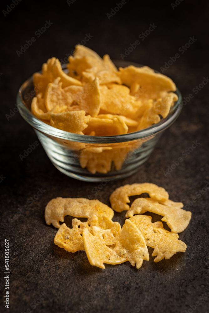 Halloween crispy bat shaped chips on dark table. Stock-Foto | Adobe Stock