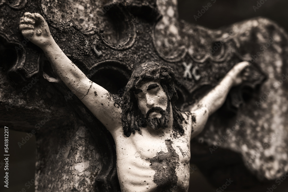 Photo & Art Print Ancient stone sculpture of Jesus Christ, crucified on ...