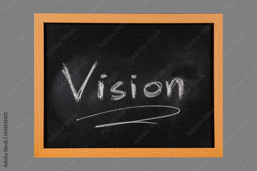 The word Vision handwritten with white chalk on blackboard with wooden ...