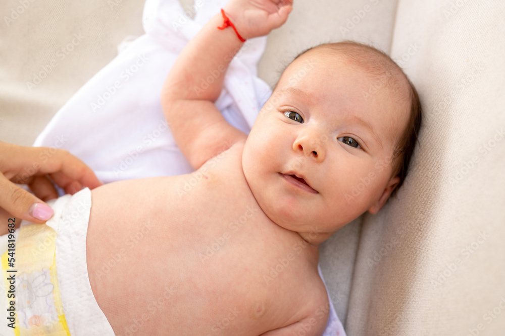 Small baby girl smiling close up. Top view baby girl. Motherhood. Stock ...