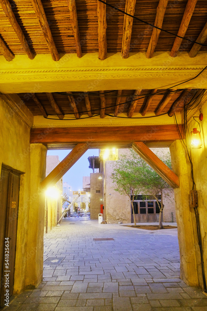 Old Dubai buildings and traditional Arabian street night view ...
