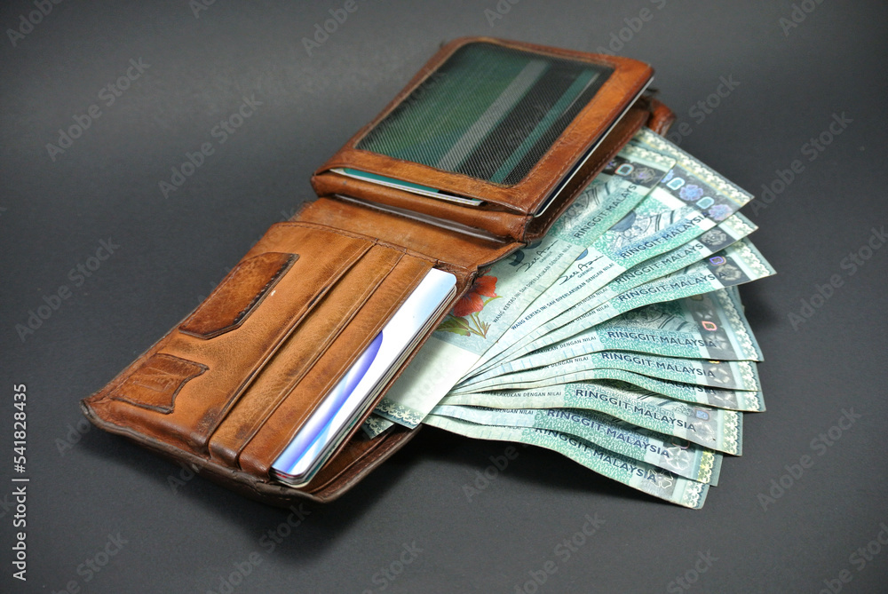 JOHOR, MALAYSIA -MAY 02, 2016: Several pieces of 50 Malaysian Ringgit ...