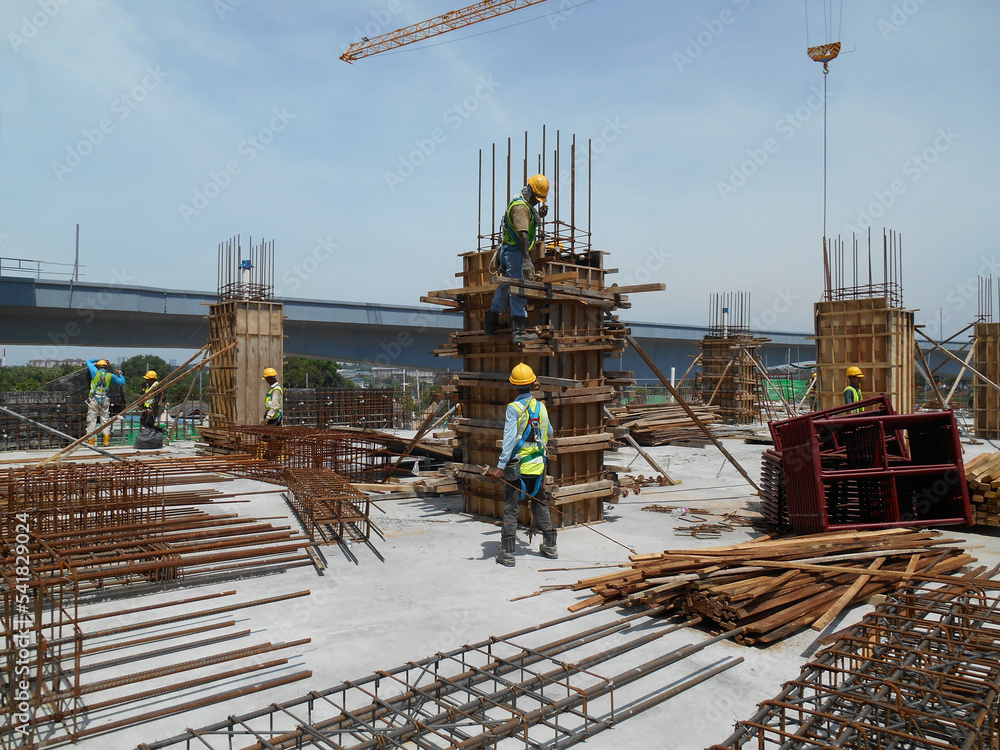 MALACCA, MALAYSIA -MARCH 25, 2016: Construction workers fabricating ...