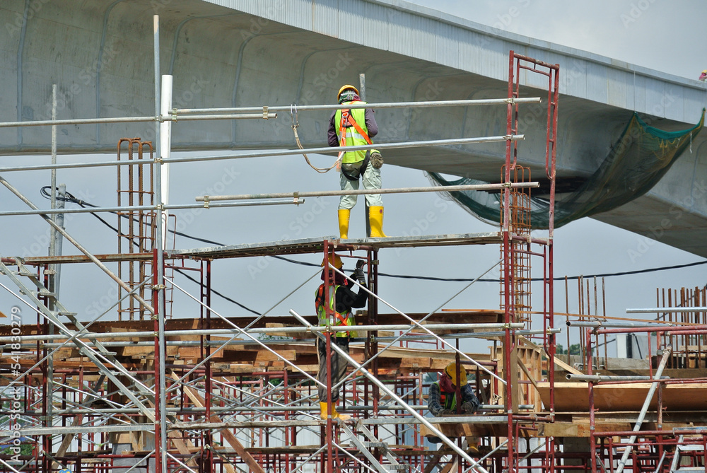 PERAK, MALAYSIA -APRIL 05, 2016: Construction workers wearing safety ...