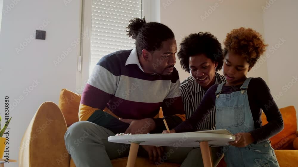 Young child drawing parents smiling Stock Video | Adobe Stock
