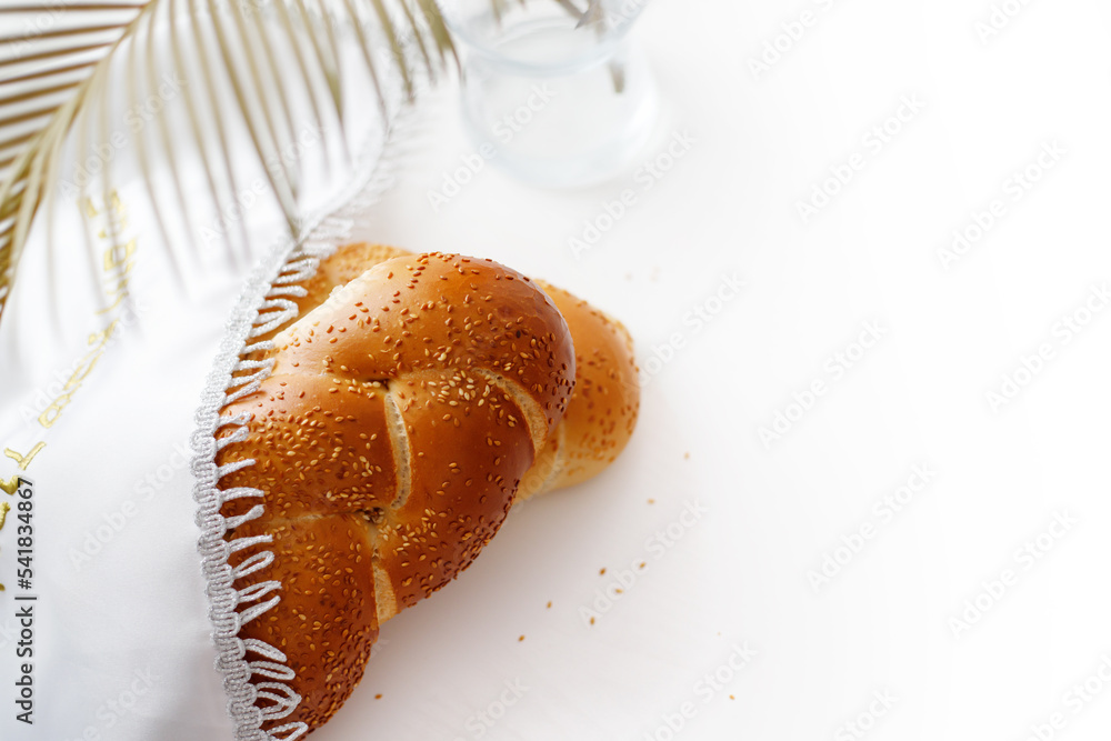 Challah bread covered with a special napkin on white background ...