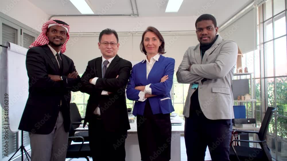 Multiracial business people standing arms crossed after research plant ...