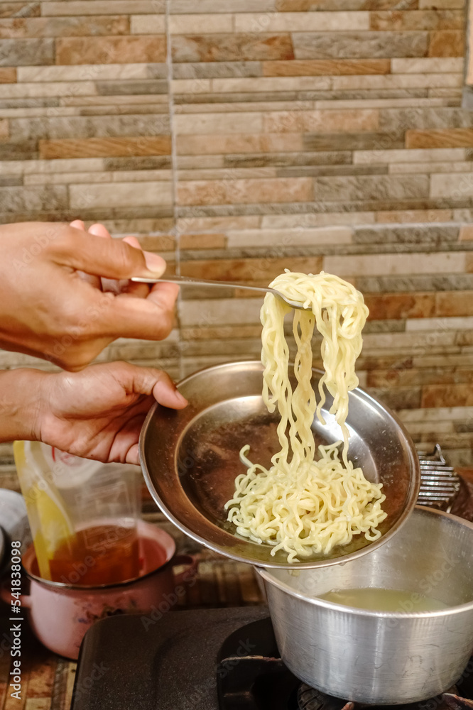 hands holding a bowl of noodles Stock Photo | Adobe Stock