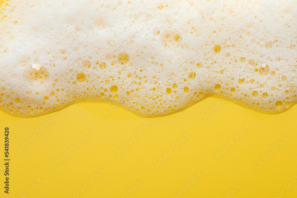 Fluffy soap foam on yellow background, top view. Space for text Stock ...