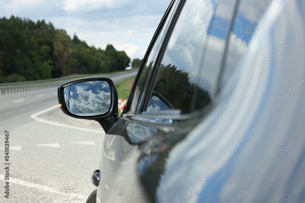 New black modern car outdoors, closeup of side rear view mirror Stock ...