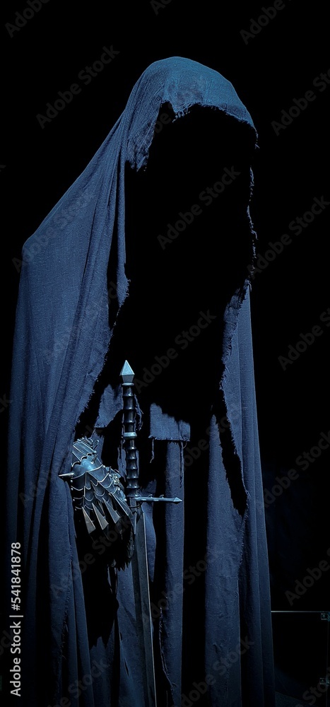 Scary shadowy figure cloaked in a shredded black robe with a longsword ...