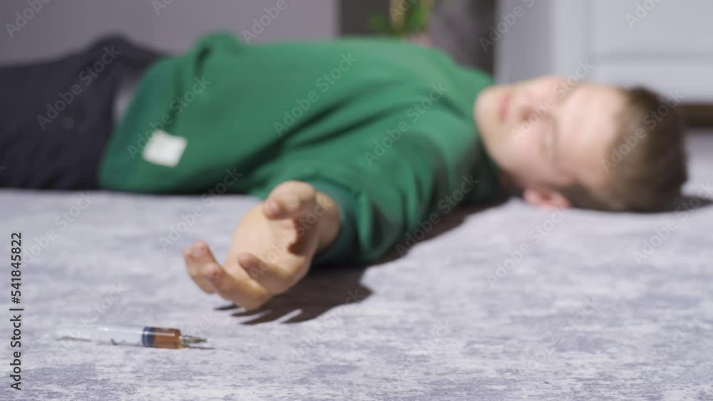 Drug addiction, high-dose drugs. Man taking high dose drug from syringe ...