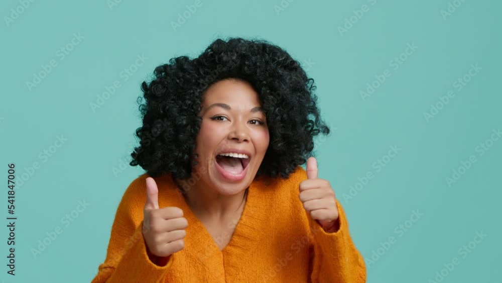 Super excited cheerful beautiful African American positive woman ...
