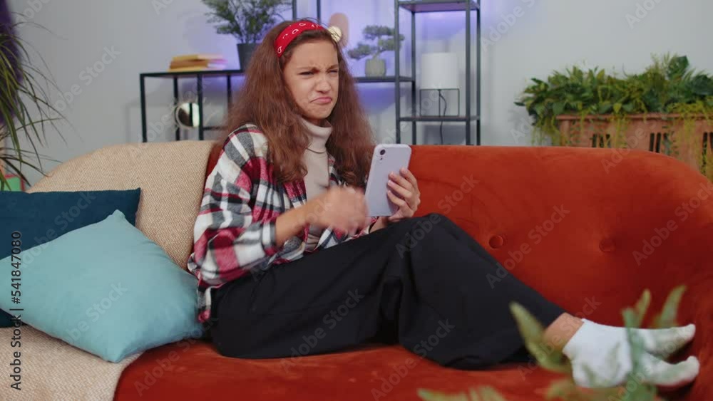 Sad preteen girl use smartphone typing browsing, loses becoming ...