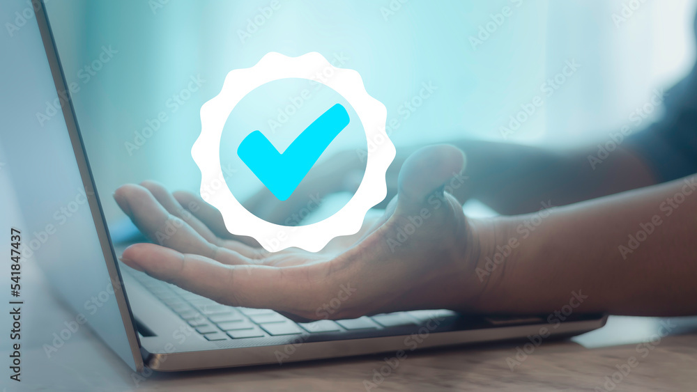Man using laptop and showing the sign of the top service. Concept of ...