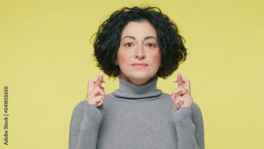 Mature pleading cute woman with wide opened eyes and lifted brows ...