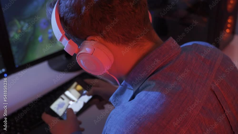 Technology addiction. Young man playing video games. Young man playing ...