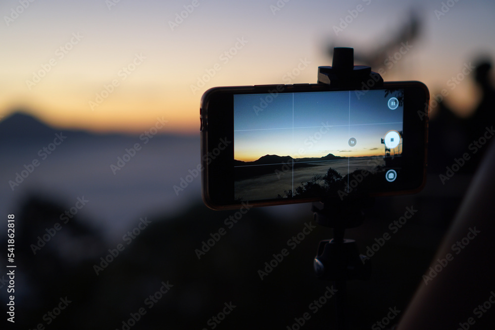 View mist on mobile Tourists using app on smart phone to take ...