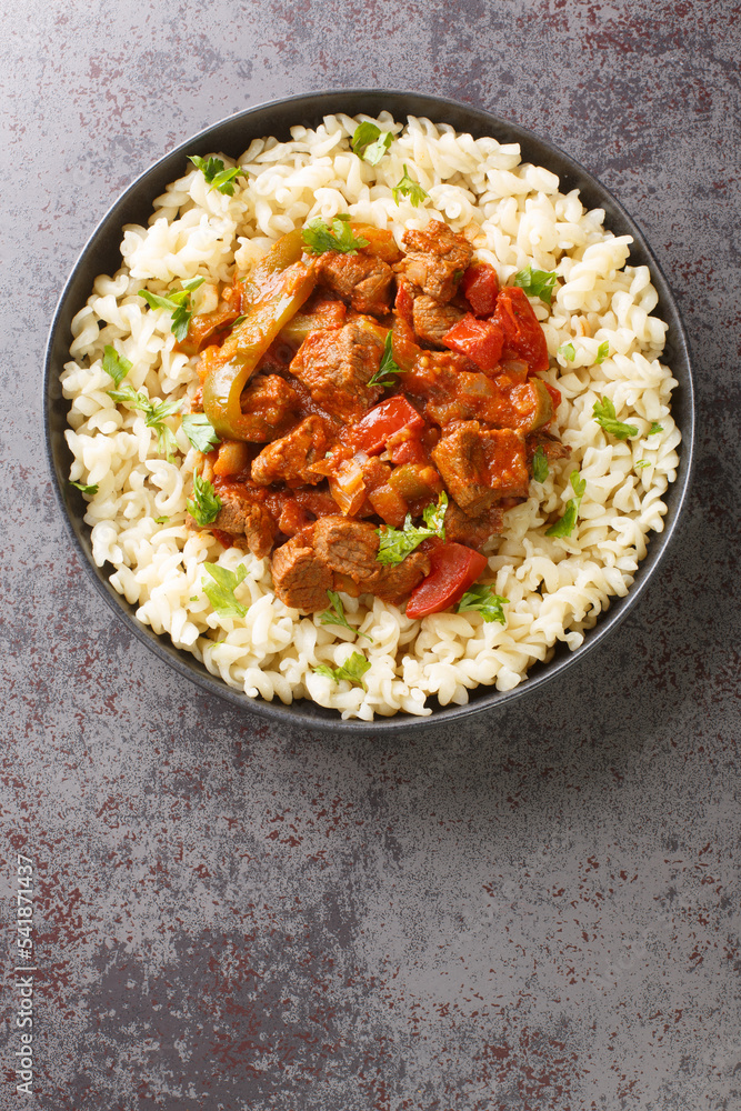 Porkolt is a classic Hungarian cuisine beef stew with onions and plenty ...