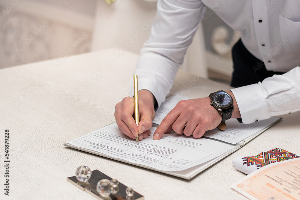 painting in the registry office at the wedding ceremony. signing a ...
