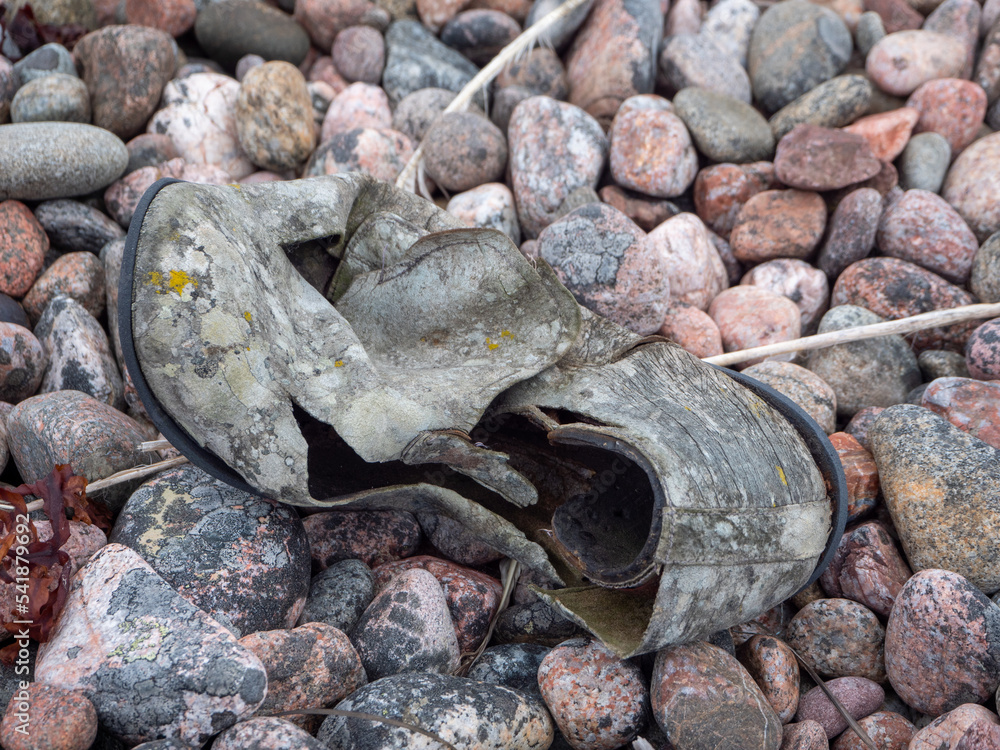 Old shoe on the rocks at Jurmo island, Finland Stock-Foto | Adobe Stock