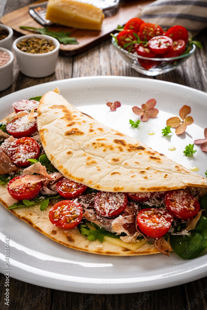 Italian piada wraps - piadina stuffed with fresh vegetable leaves ...