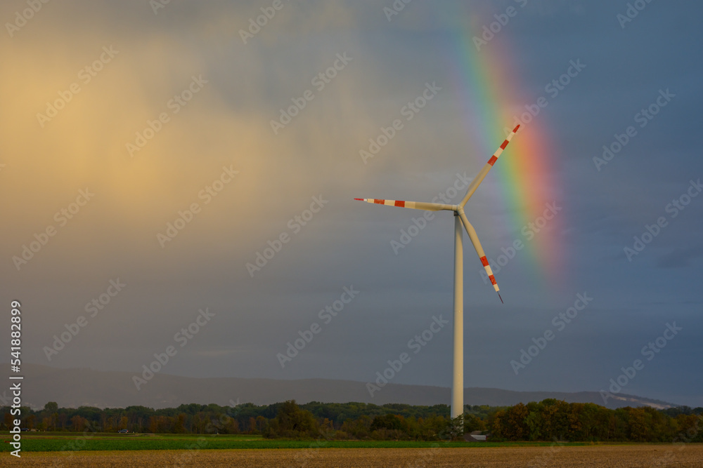 windmill in the nature with small rainbow Photos | Adobe Stock