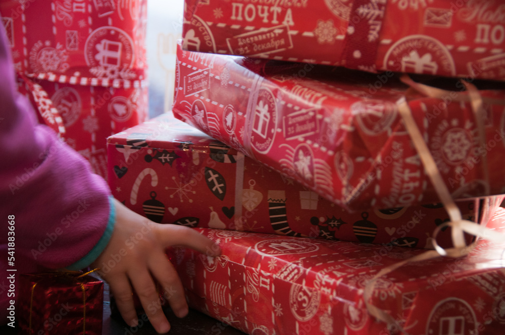 New year gifts in hands. Stock Photo | Adobe Stock