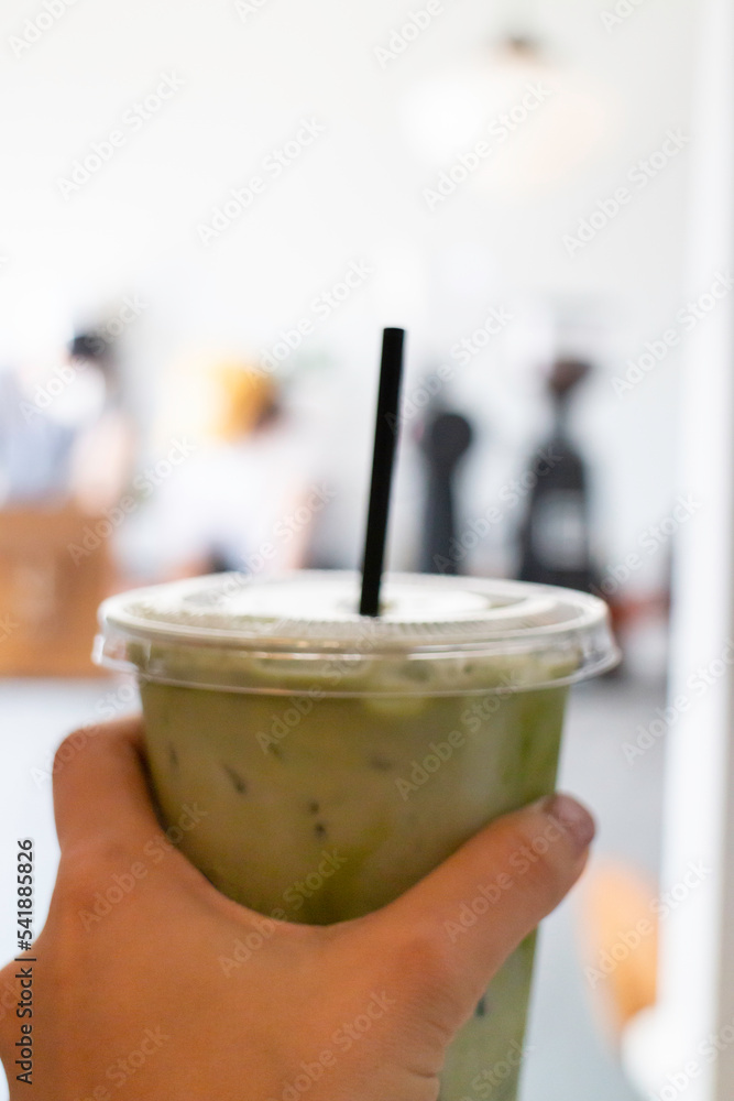 Melted iced green tea latte Stock Photo | Adobe Stock