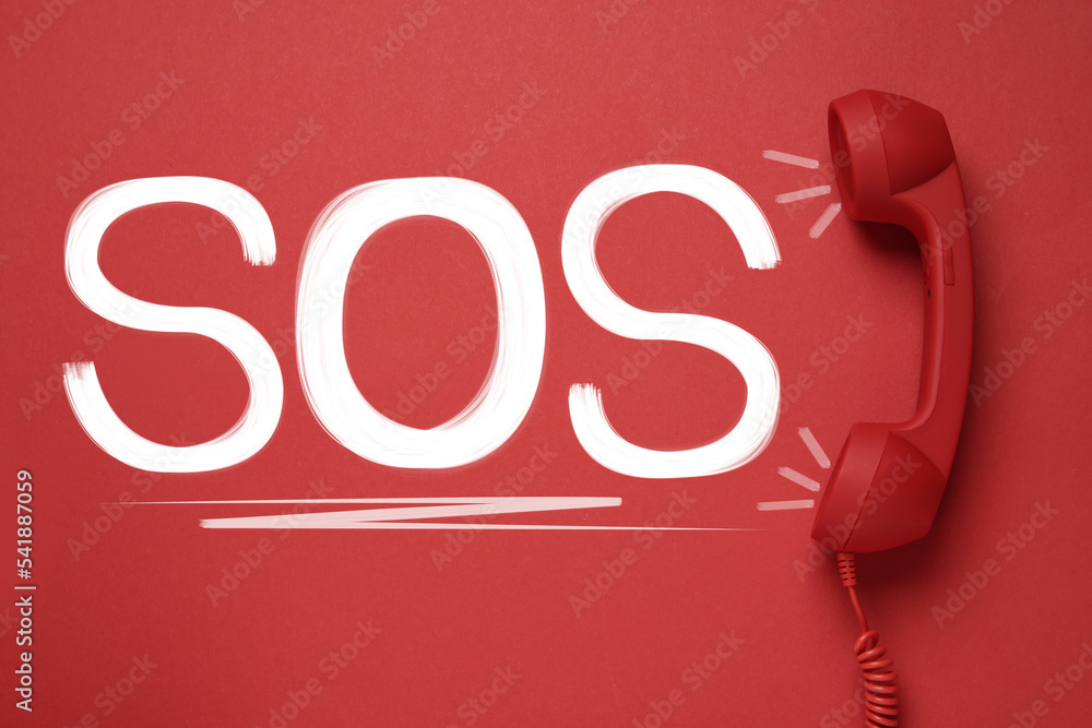 Telephone handset on red background, top view. Emergency SOS call Stock ...