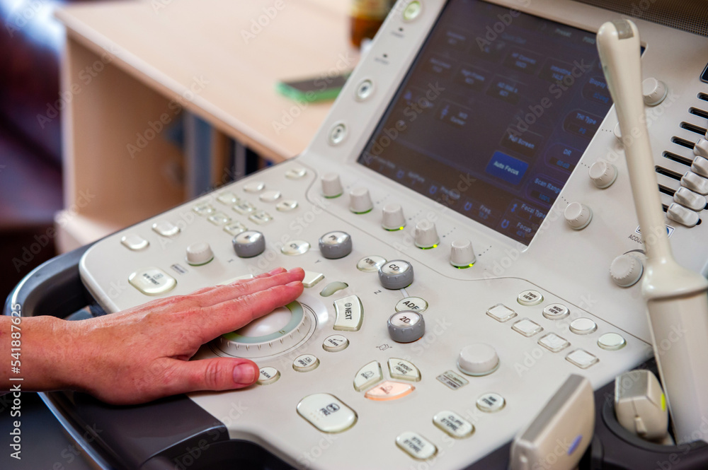 Male patient undergoing ultrasound scan in clinic Stock Photo | Adobe Stock