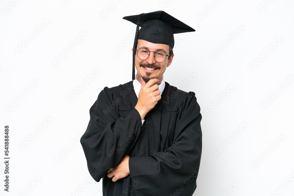 Young university graduate man isolated on white background with glasses ...