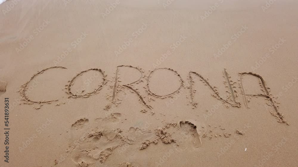 corona written in sand in beach covid 19 virus pandemic Stock Video ...
