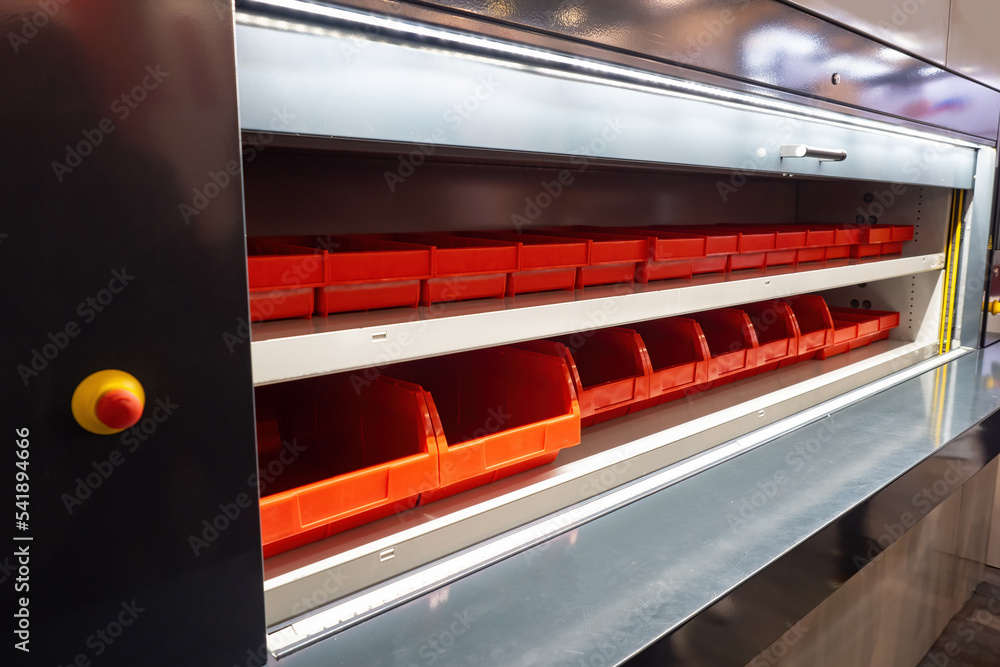 Red cells for storage. Metal cabinet with storage compartments ...