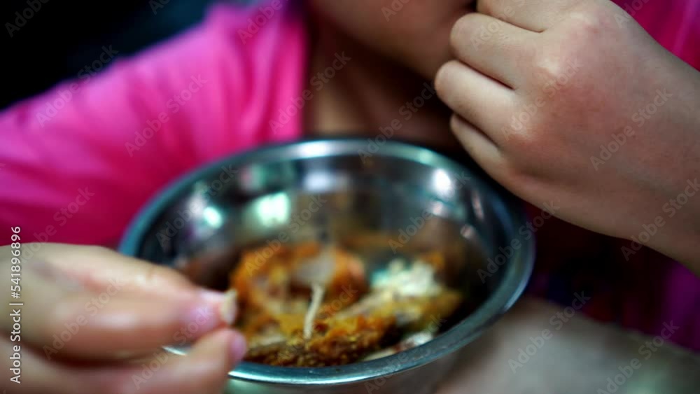 Selective focus little girl use hand eat fried chicken Stock Video ...
