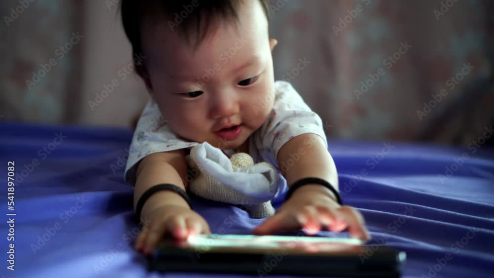 Little baby grab the hp and try to chew. Cute infant boy Stock Video ...