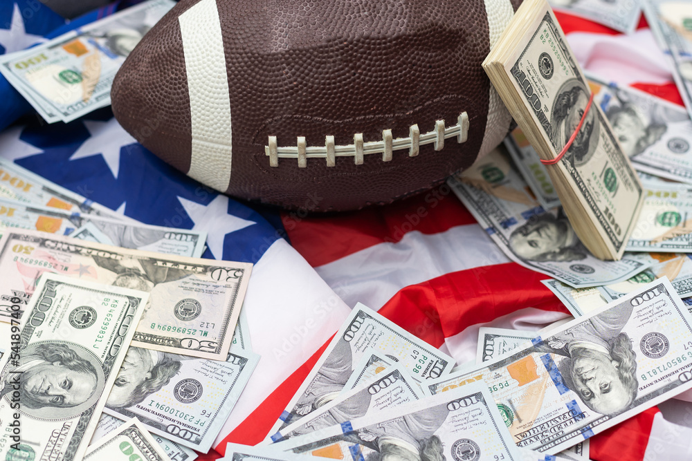 Money and rugby ball on american flag background, closeup. Concept of ...