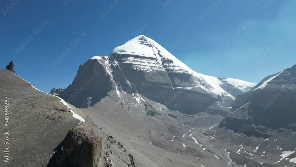 Aerial footage of the sacred Mount Kailash with a snowy peak under the ...