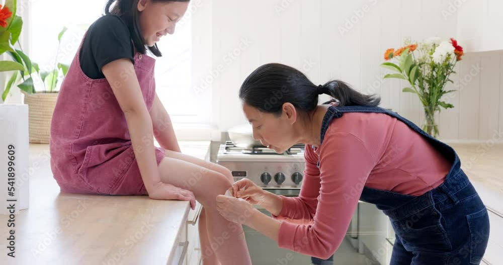 Mother, care and child with bandage for injury, wound and hurt knee ...