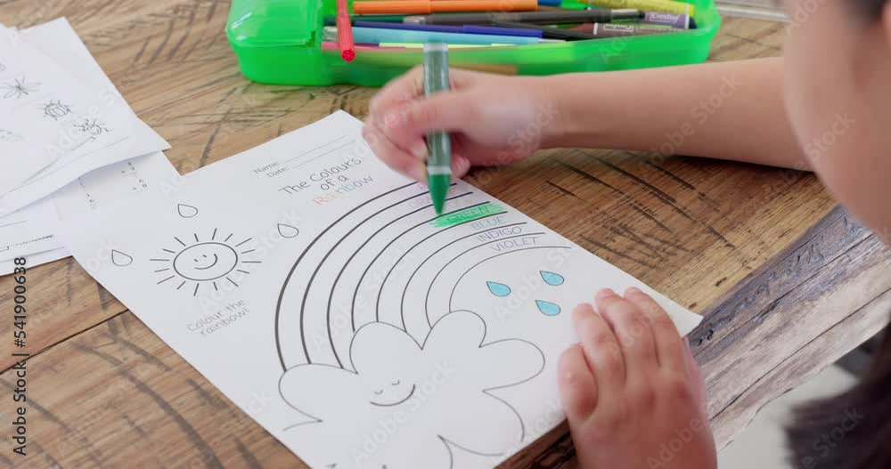Hands, children and art with a student girl coloring in a picture in ...