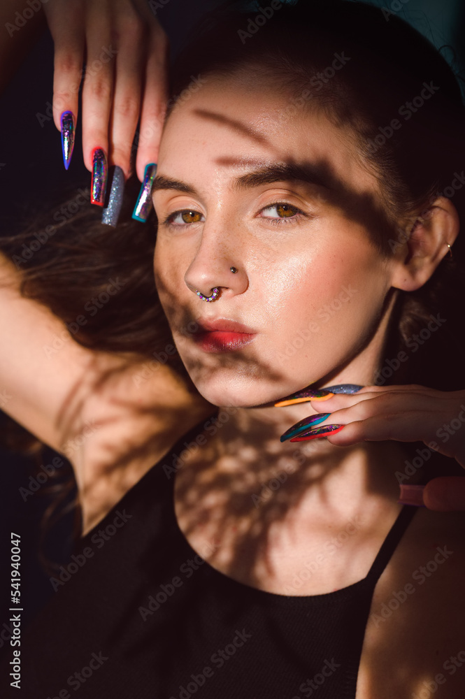 Beautiful model girl with manicured nails. Facial treatment ...