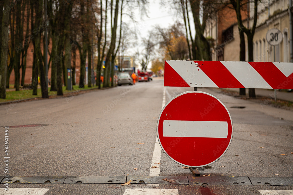 Road closed barrier on a city street. Closed street in the city during ...