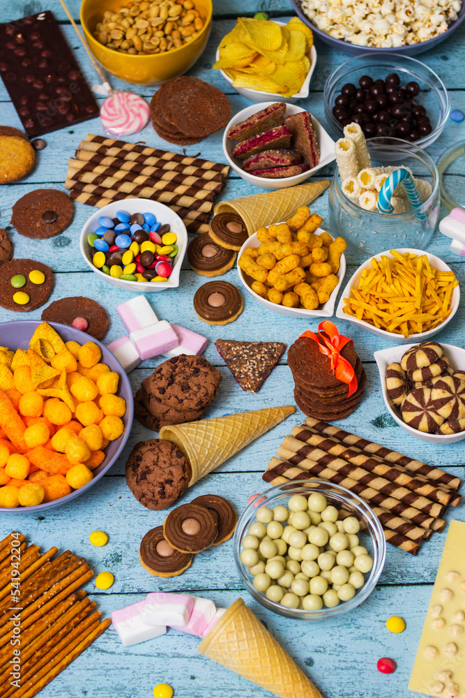Salty and sweet snacks. Table of salty and sweet snacks. Large group of ...
